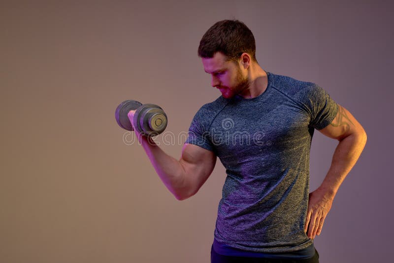 Skilled Bodybuilder Bending His Arm Stock Photo - Image of person ...