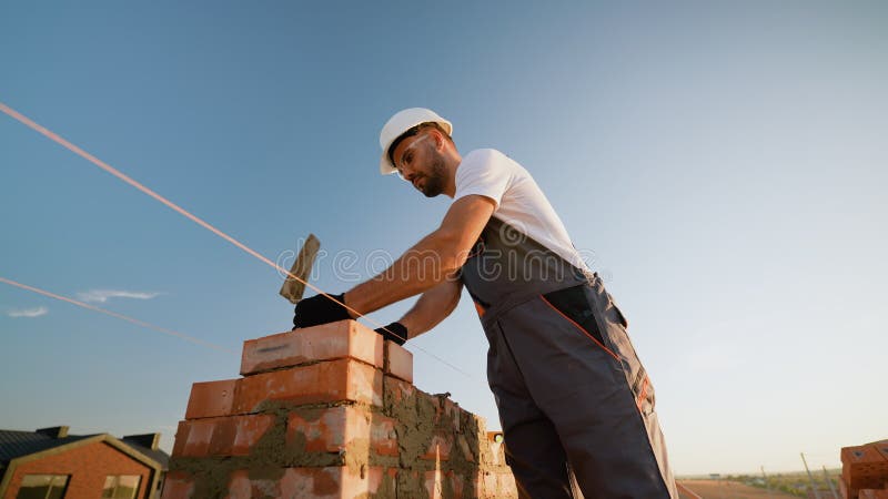 Builder Laying Bricks at Townhouse Construction Site Stock Video ...
