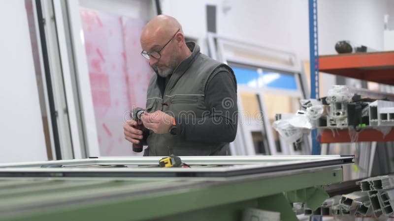 Carpenter Assembling Aluminum Window Frame in Workshop Stock Video ...