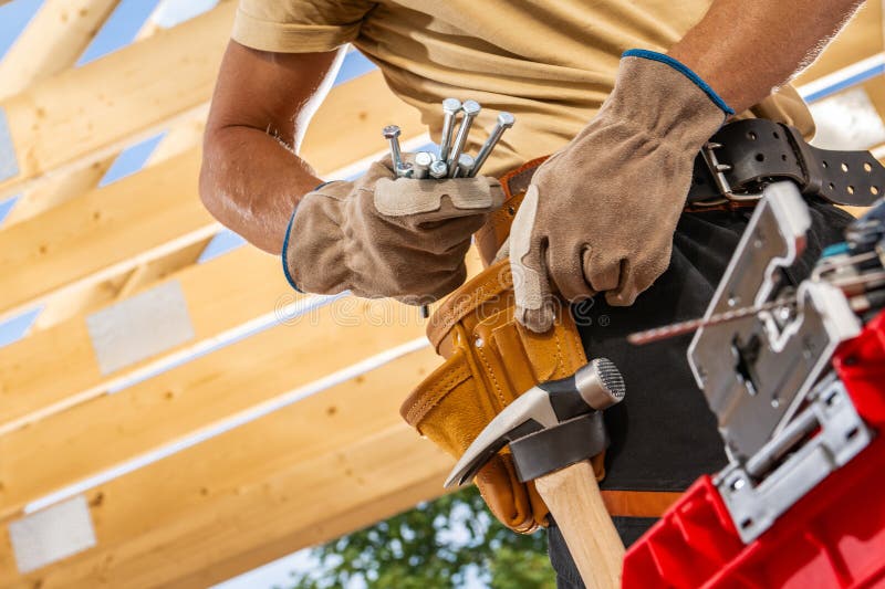 Skilled Carpenter Organizing Tools in a Workshop while Preparing for a ...