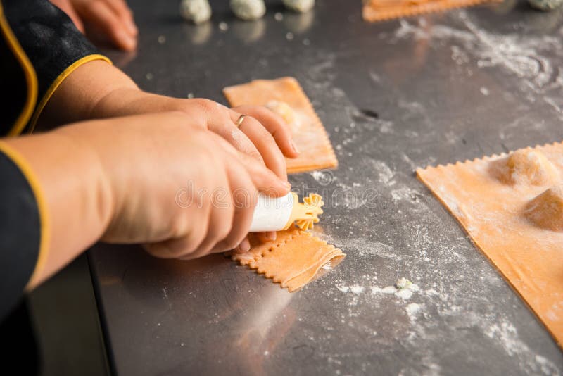 A Skilled Chef Prepares Delicious Handrolled Ravioli Pasta in a Classic ...