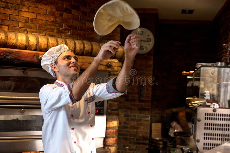 Skilled Chef Preparing Dough for Pizza Rolling with Hands and Th Stock ...