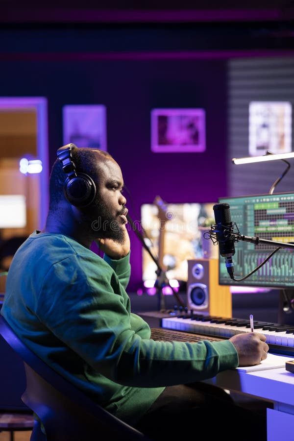 Skilled Composer Writing Rhymes and Lyrics To Create New Music in Home ...