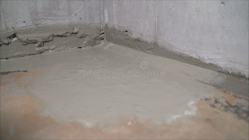 Construction Worker Applying Waterproofing Material on Concrete Floor ...