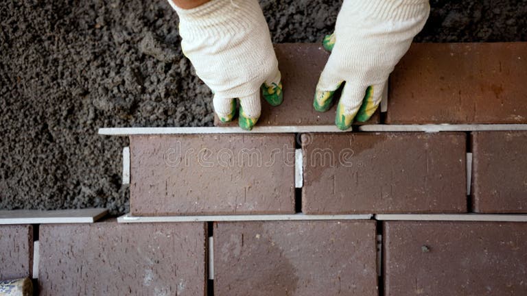 Construction Worker Placing Bricks for Patio Paving Stock Image - Image ...