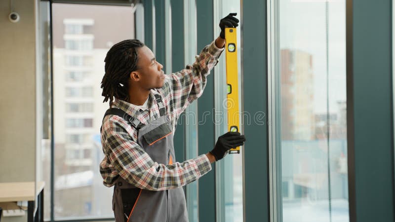 African American Worker Installing Window with Level Stock Video ...