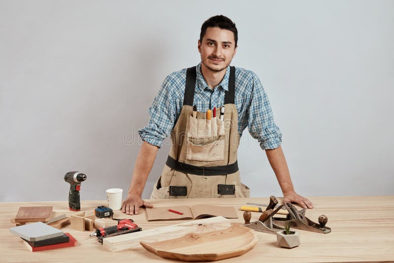 Confident Young Woodworker Standing Next To Workbench in His Carpentry ...