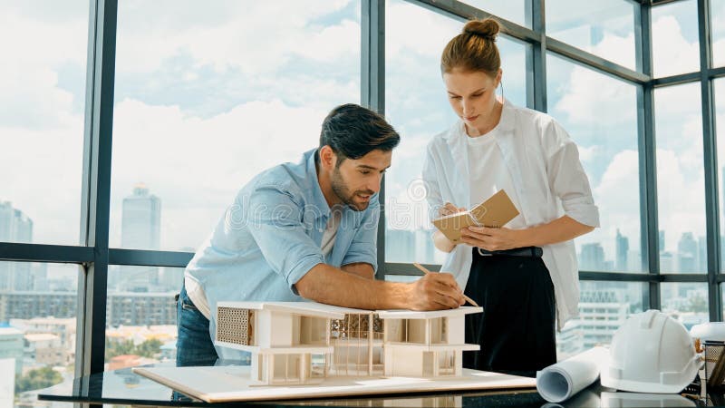 Skilled Engineer Team Discussion about House Model Construction ...