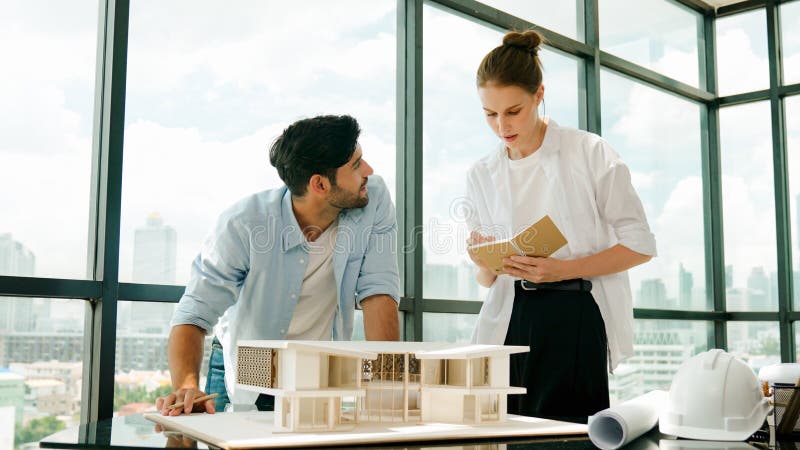 Skilled Engineer Team Discussion about House Model Construction ...