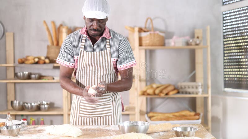 Experienced African Baker Cutting Dough on Floured Surface, Preparing ...