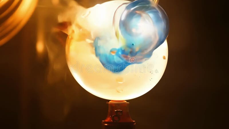 A Skilled Glass Artist Expertly Blowing Tiny Bubbles into a Delicate ... A Skilled Glass Artist Expertly Blowing Tiny Bubbles into a Delicate ...