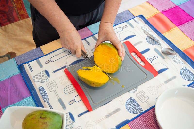 Skilled Hands Craft a Delicious Mango Dish Ready To Eat Stock Photo ...