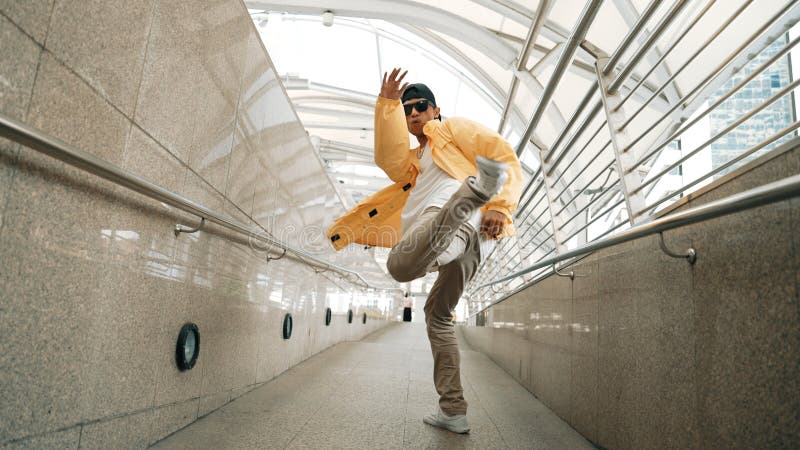 Skilled Happy Asian Hipster Walking while Dancing in Narrow Corridor ...