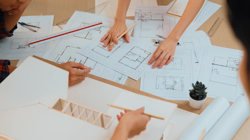 Skilled Interior Designer Team Focusing on Their Performance ...