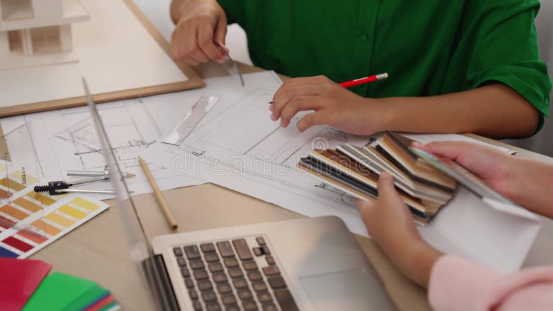 Skilled Interior Designer Team Focusing on Their Performance ...