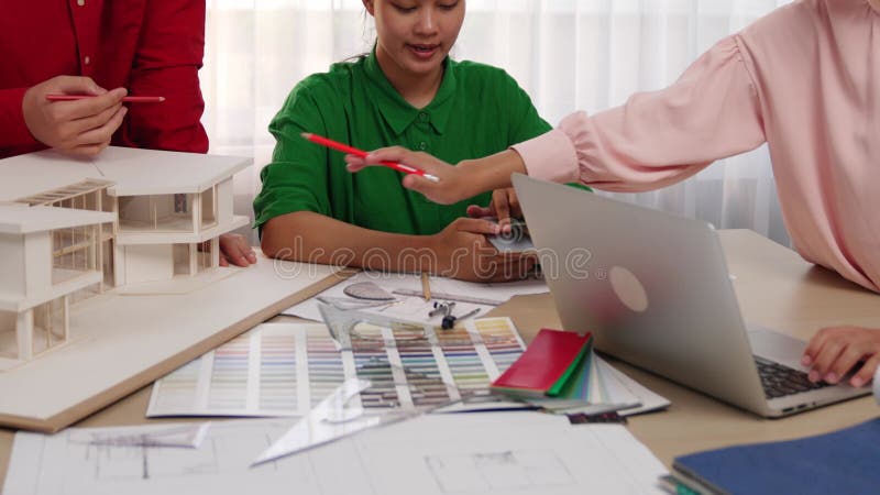 Skilled Interior Designer Team Focusing on Their Performance ...