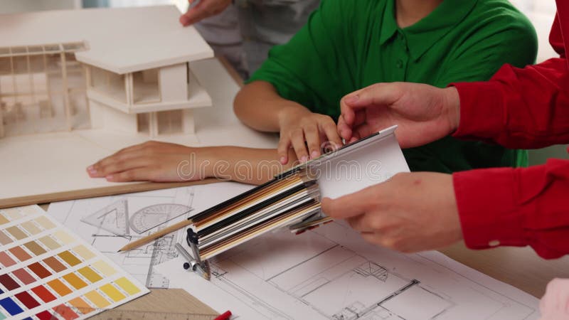 Skilled Interior Designer Team Focusing on Their Performance ...