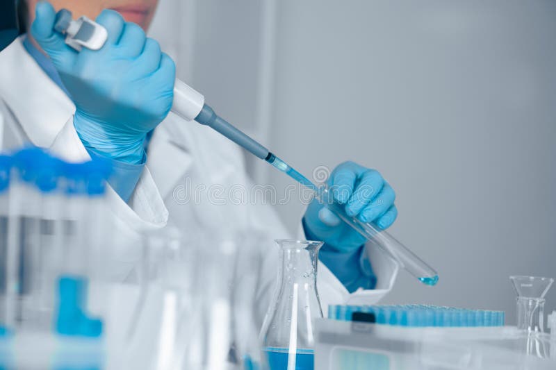 A Skilled Laboratory Technician Uses Precise Pipetting Techniques ...