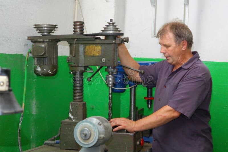 Skilled Labourer with Drilling Machine Stock Photo - Image of action ...