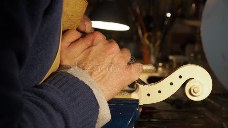 Luthier Carefully Carving Violin Neck in Workshop Stock Video - Video ...