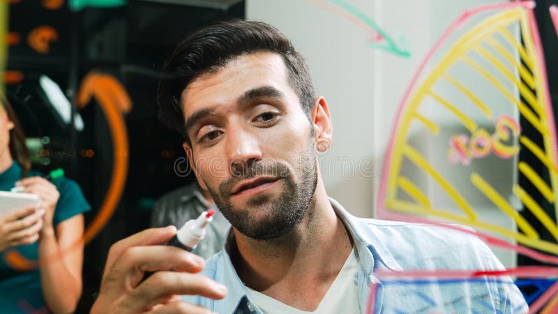 Skilled Male Leader Explain Statistic Graph by Drawing Graph. Tracery ...