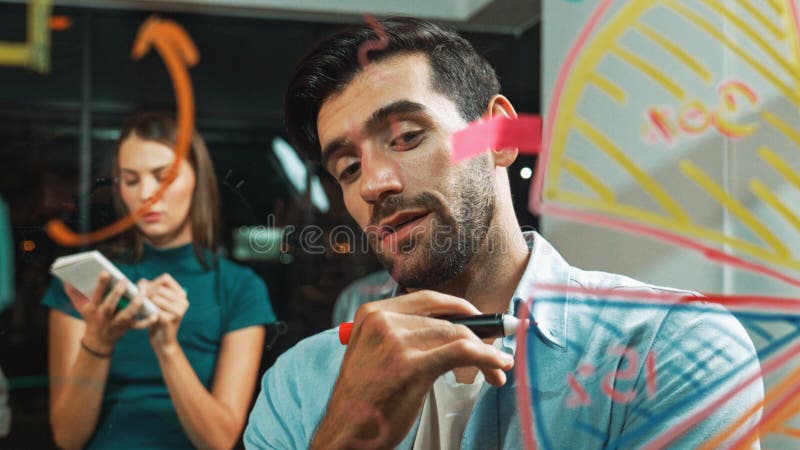 Skilled Male Leader Explain Statistic Graph by Drawing Graph. Tracery ...