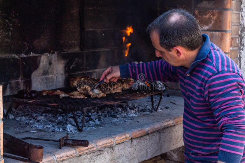 Skilled Man Cooking a Roasted Meat Stock Photo - Image of hand ...