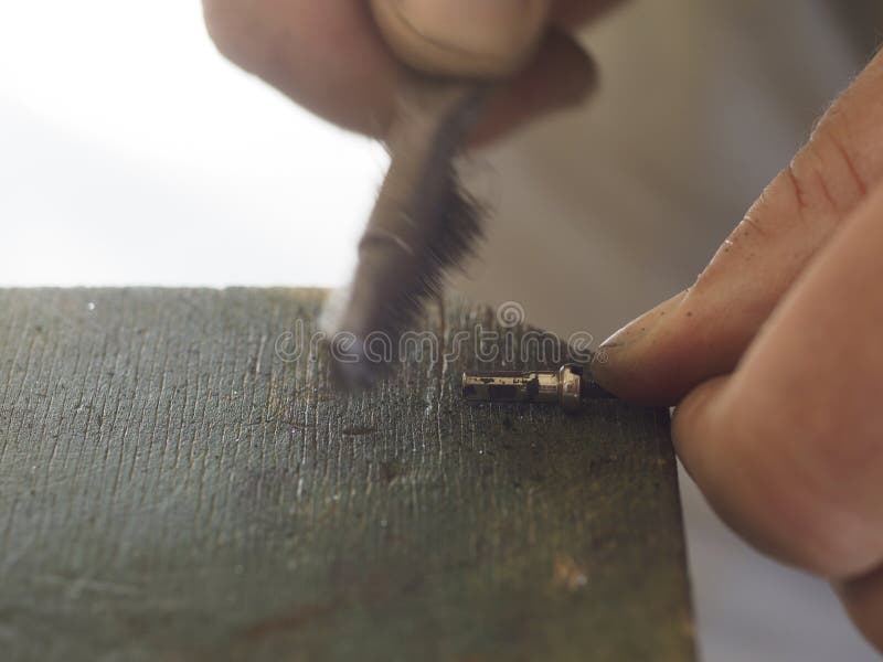 Mechanic Cleaning Metal Part with Wire Brush Stock Photo - Image of ...