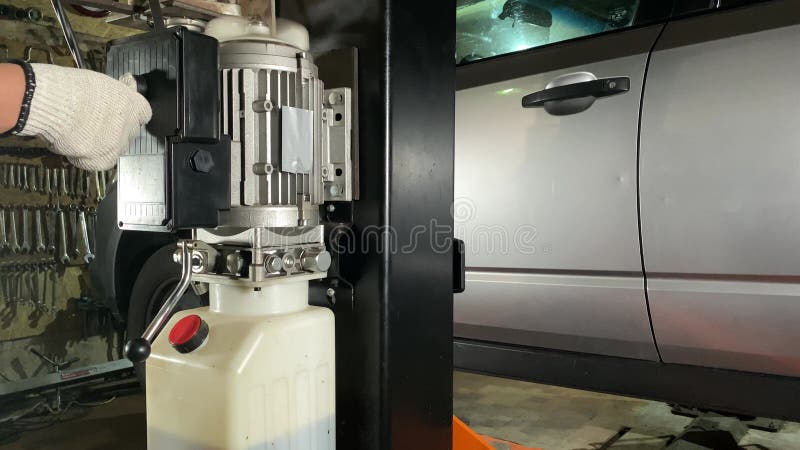 Skilled Mechanic Lifting Car for Inspection and Repair Stock Video ...