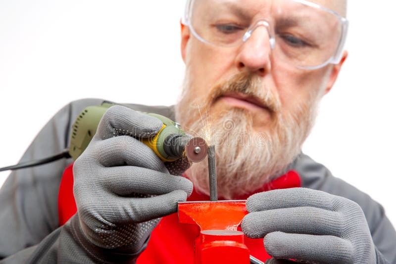 Skilled Mechanic Working with a Handheld Engraving Drill To Precisely ...