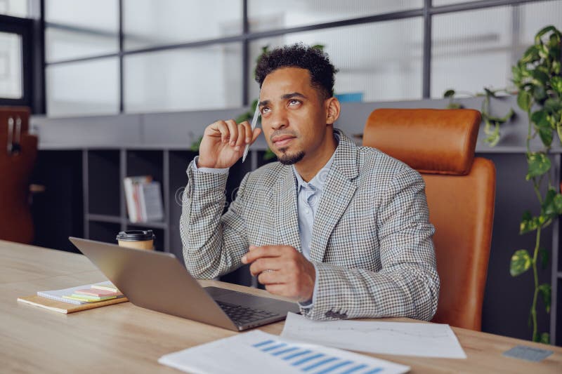 A Skilled Professional in a Modern Office, Actively Engaging in Various ...