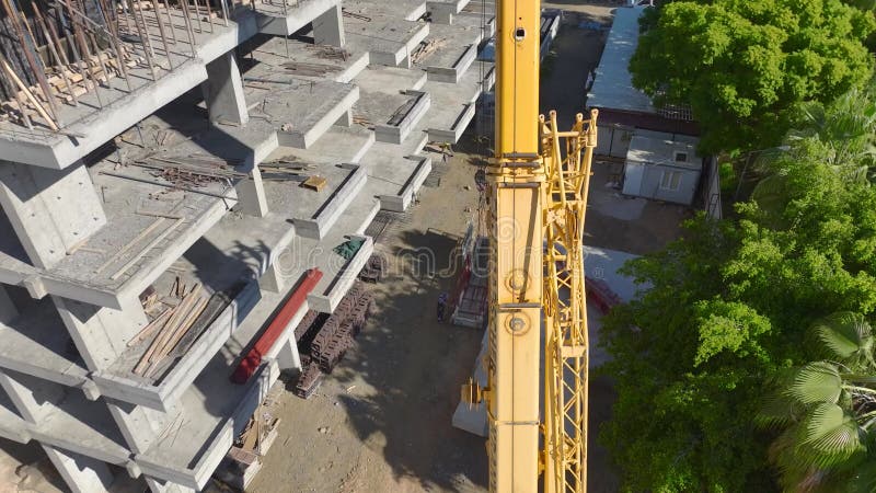 Aerial View: Workers Assemble Massive Crane Sections while Engineers ...