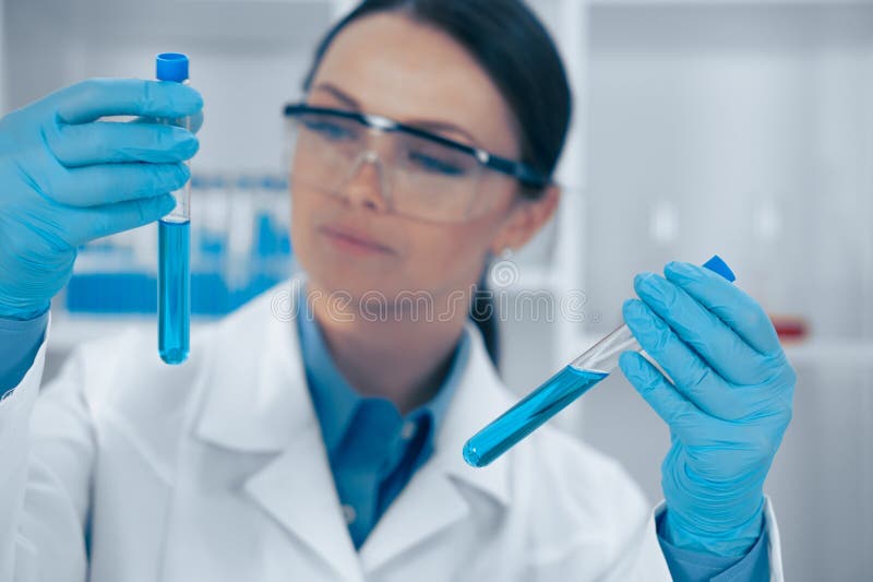 A Skilled Scientist Analyzes Complex Chemical Solutions in a Topnotch ...