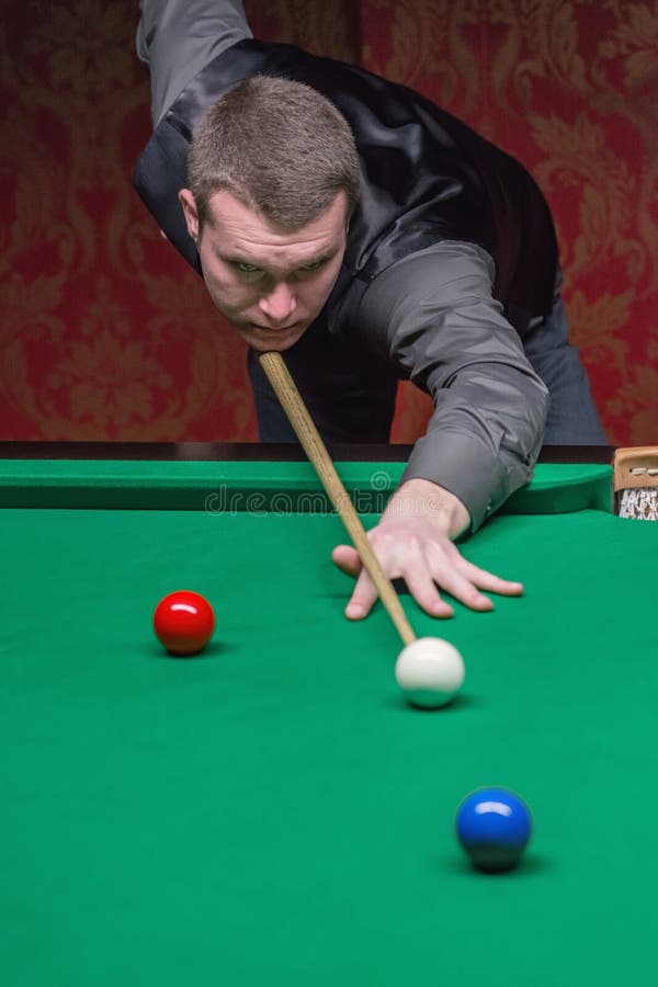 A Skilled Snooker Player Engaged in a Captivating Game of Precision and ...