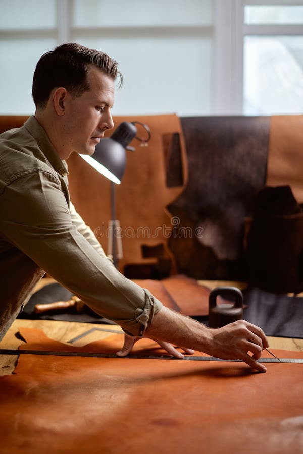 Skilled Tailor Cuts and Measures Fabric According To a Pattern Stock ...