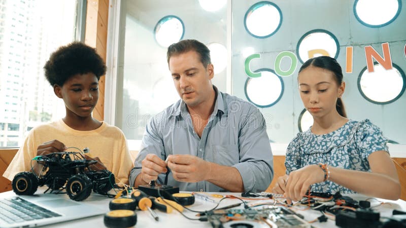 Teacher Teaching Diverse Students Fixing Car Model by Using Wire ...