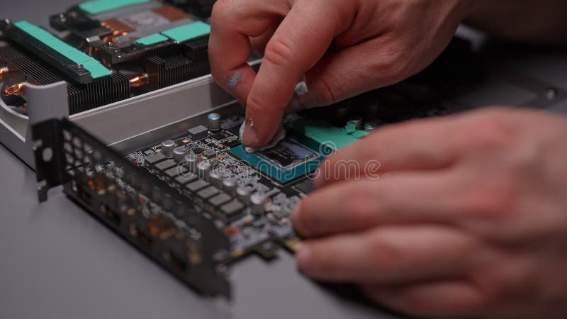 Skilled Technical Staff Removing Old Thermal Paste from CPU Chip on ...