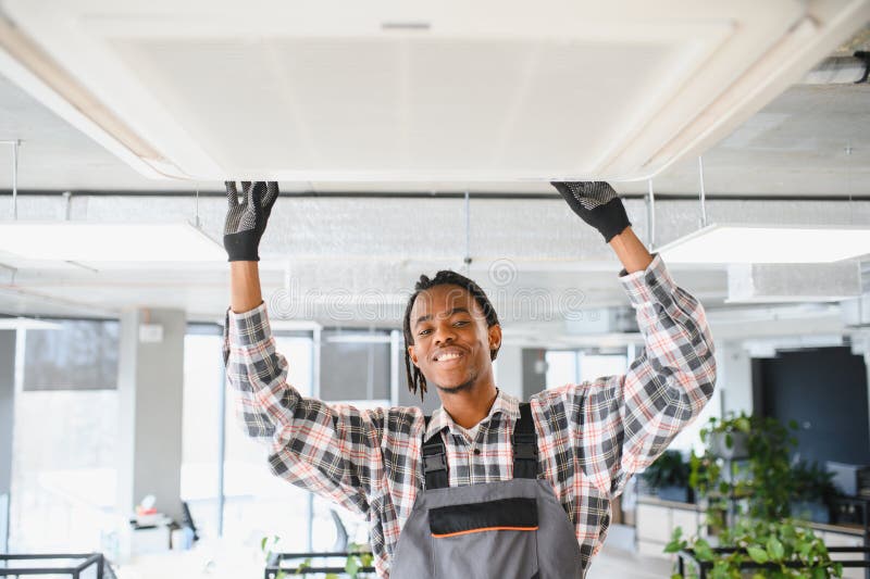 Skilled Technician Maintaining Office Air Conditioning Unit Stock Image ...