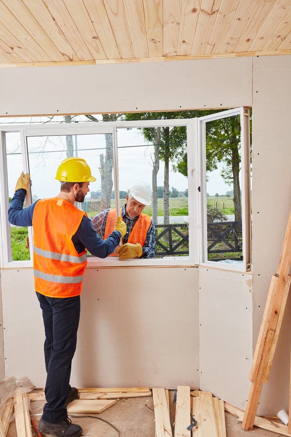 Skilled window fitters stock image. Image of fitter - 101149717