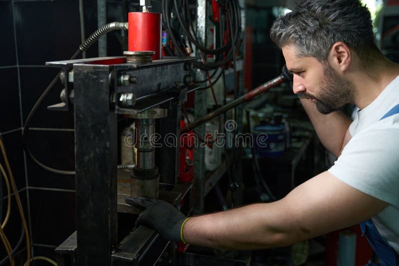 Skilled Worker is Repairing Metal Part Using Machine Stock Image ...
