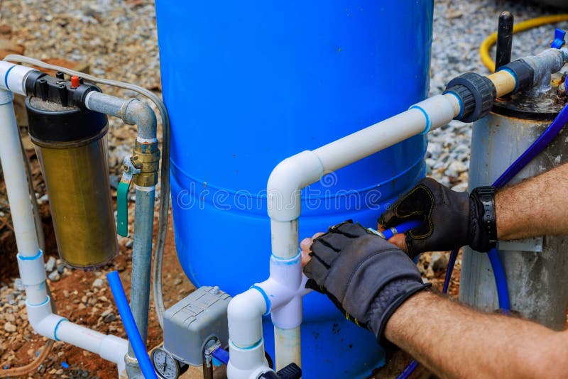 Plumber Fixes Artesian Water Well System at Construction Site during ...