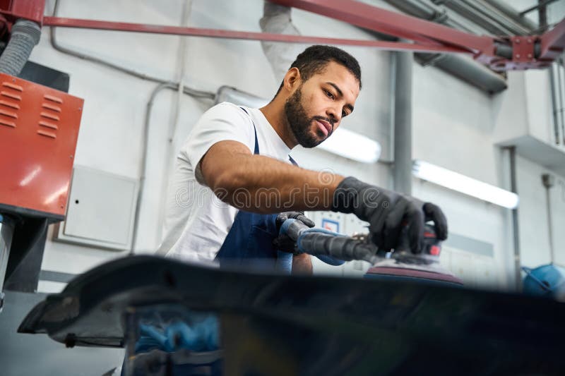 Skilled Young Mechanic Performing Precise Work Stock Image - Image of ...
