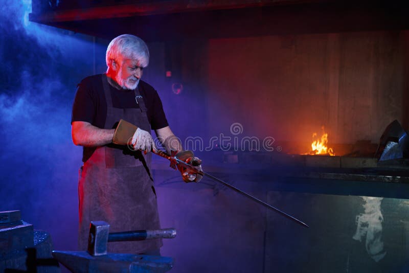 Skillful Caucasian Blacksmith in Gloves Making Sharp Sword Stock Image ...