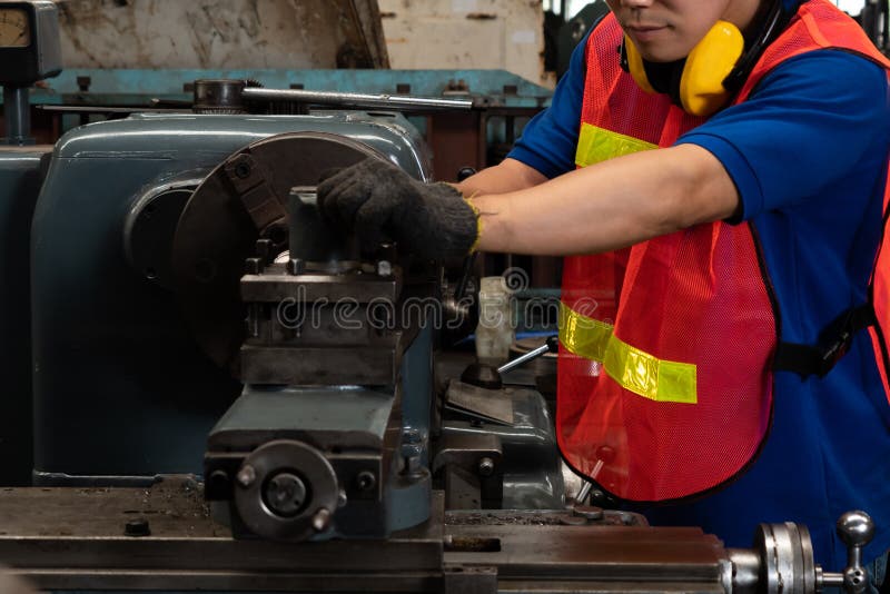 Skillful Factory Worker or Engineer Do Machine Job in Manufacturing ...