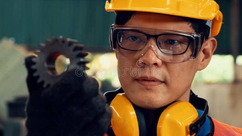 Skillful Factory Worker Looking at Machine Part in Workshop Stock Photo ...