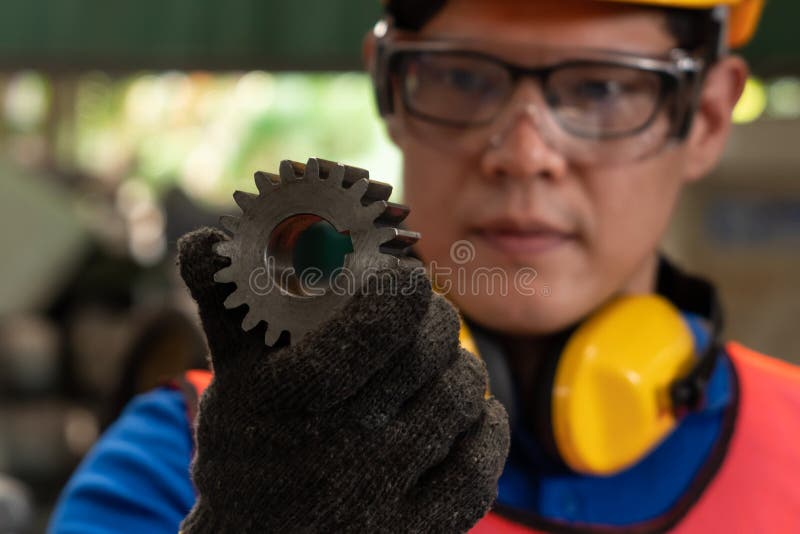 Skillful Factory Worker Looking at Machine Part in Workshop Stock Image ...