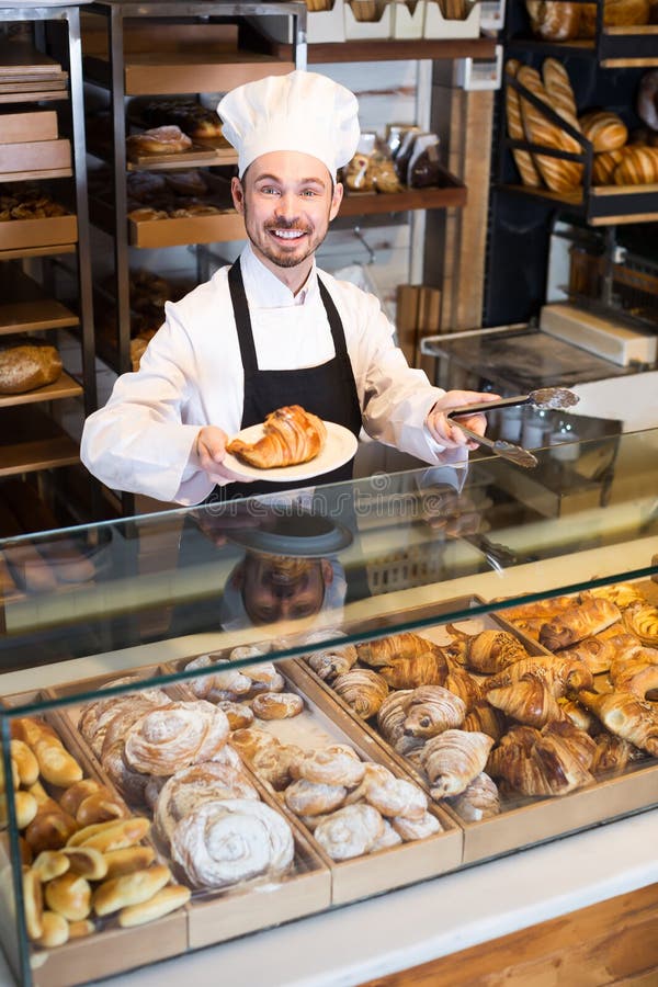 Skillful Male Pastry Maker Demonstrating Croissant Stock Photo - Image ...
