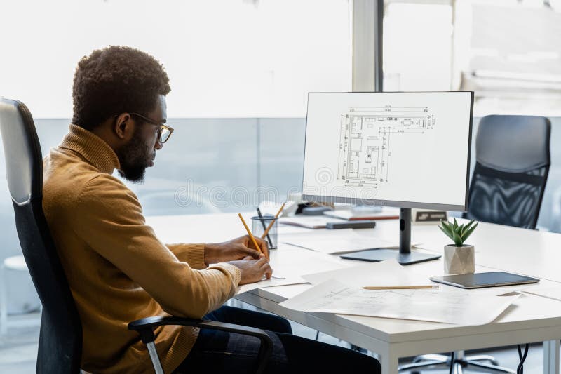 Skillful Man Architect Creating Blueprints for New Projects on Computer ...