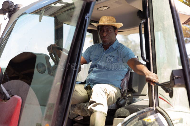 Man Driving Farm Tractor during Spring Works on Cowshed Stock Photo ...