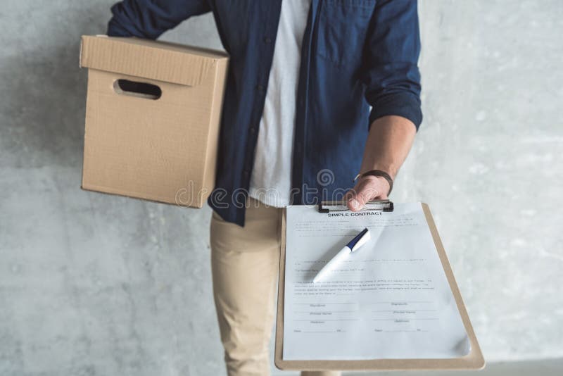 Skillful Messenger is Stretching Out Folder with Document Stock Photo ...